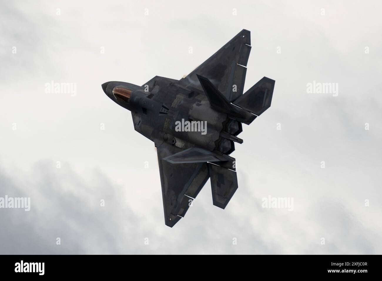 A U.S. Air Force F-22 Raptor assigned to the 3rd Wing flies over Joint ...