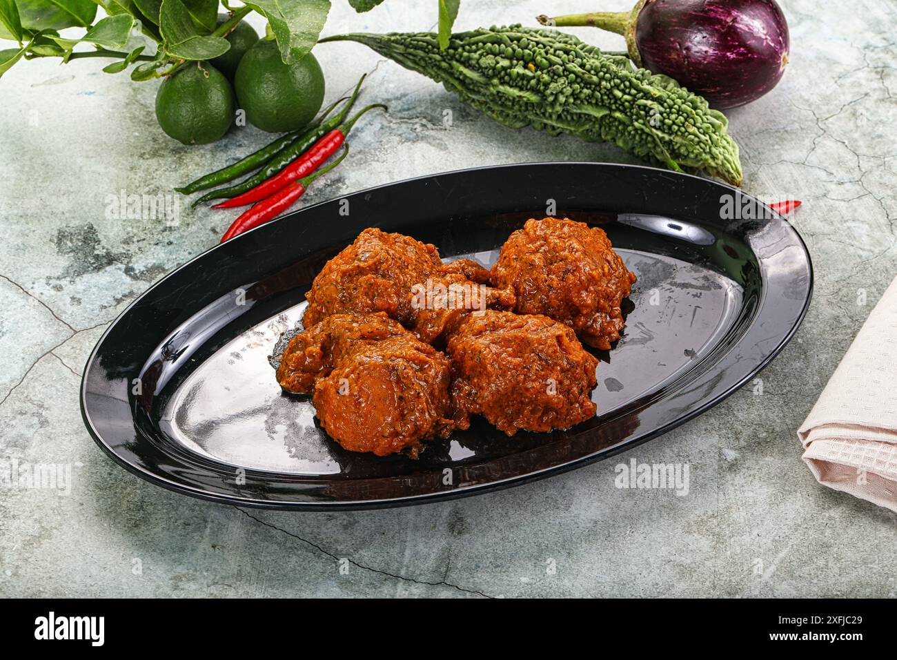 Kashmiri aloo dum - potato stuffed cheese and sauce Stock Photo - Alamy