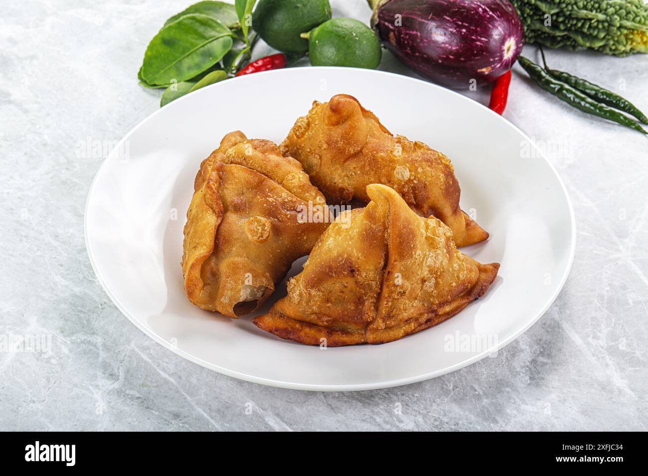 Indian cuisine - fries crispy stuffed samosa Stock Photo - Alamy