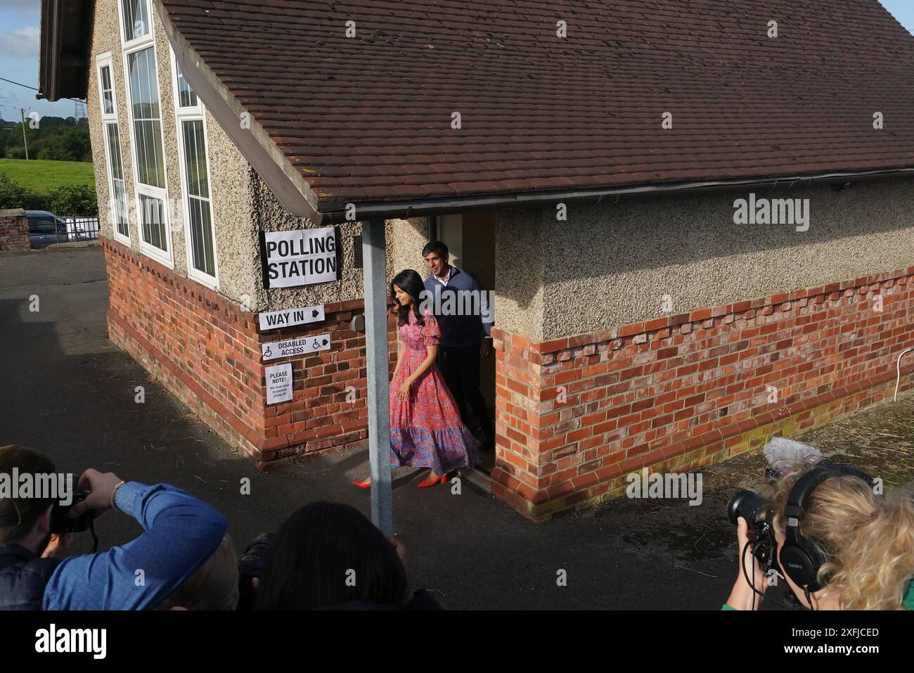 Prime Minister Rishi Sunak and his wife, Akshata Murty, leave after casting their vote in the ...