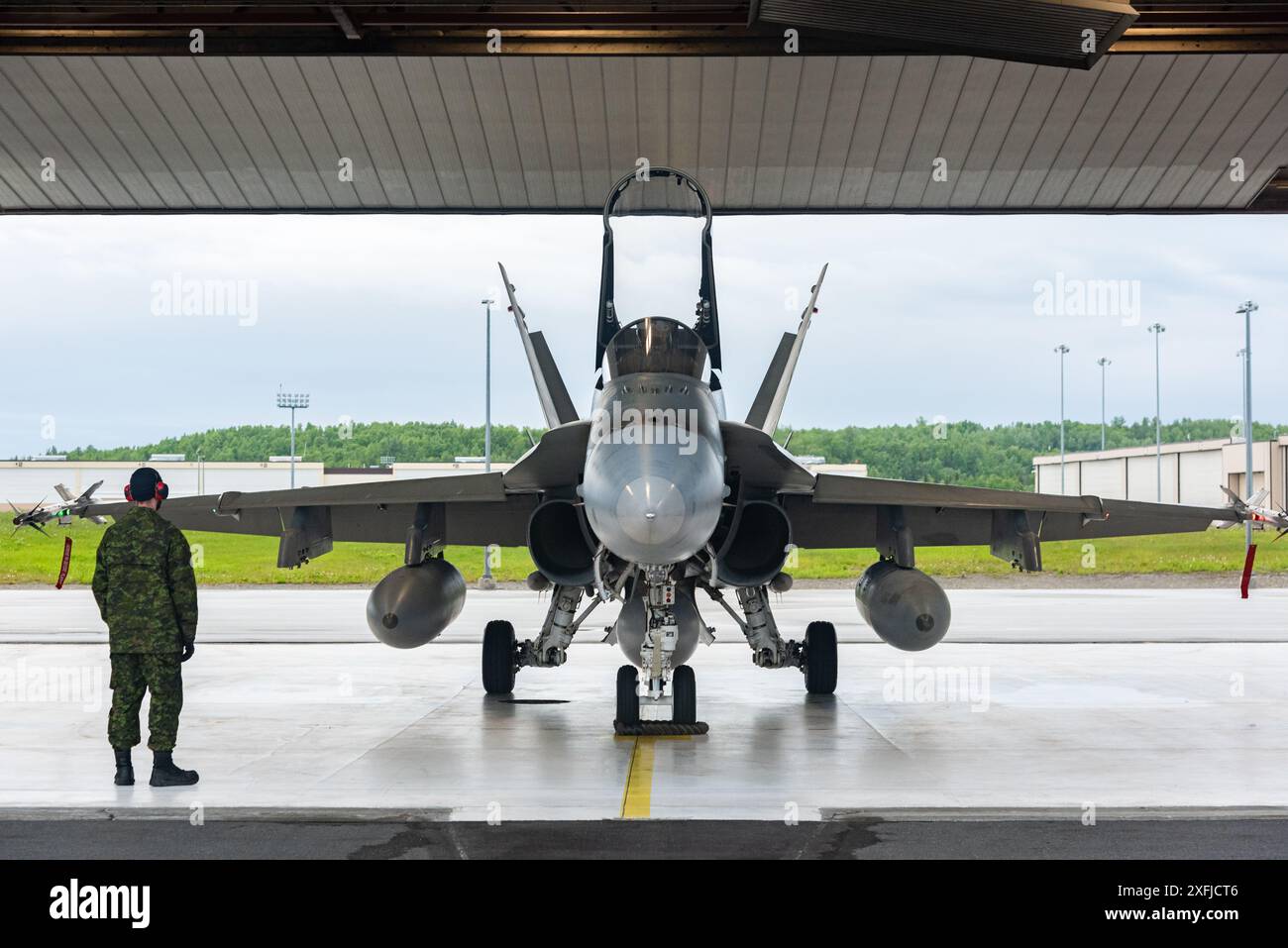 North American Aerospace Defense Command CF-18 Hornet crews prepare to ...