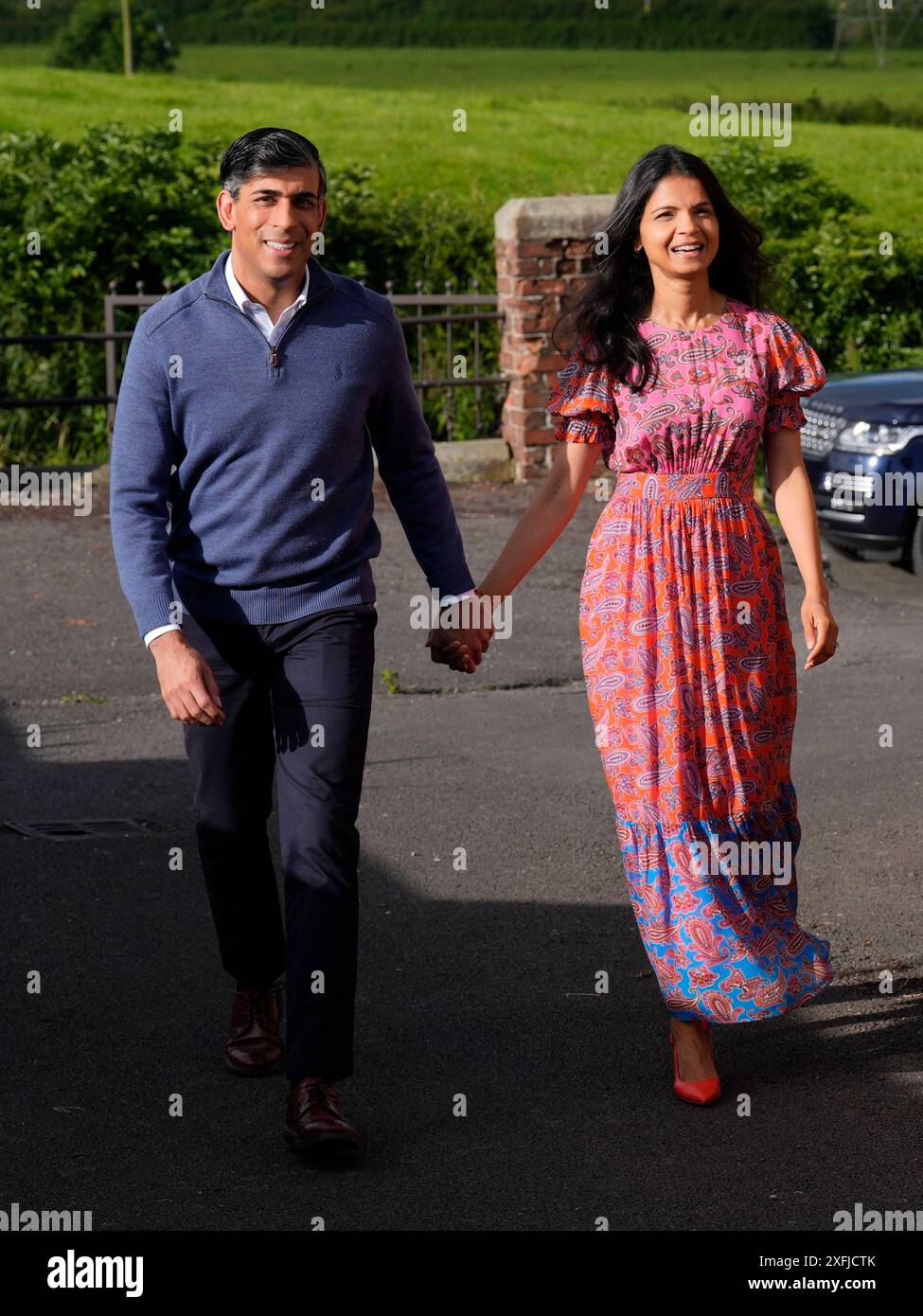 Prime Minister Rishi Sunak and his wife Akshata Murty arrive to cast their vote in the 2024 ...