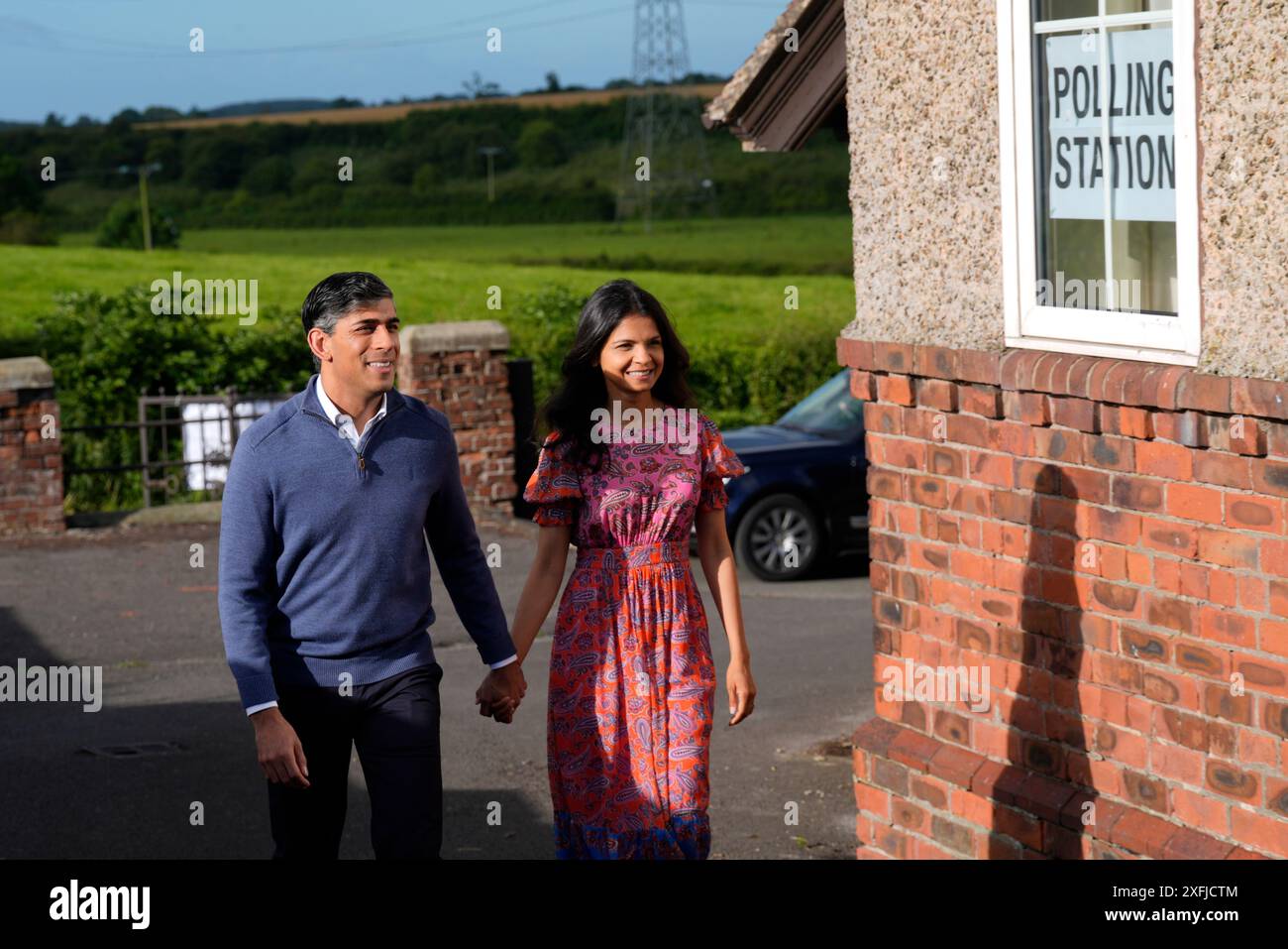 Prime Minister Rishi Sunak and his wife Akshata Murty arrive to cast their vote in the 2024 ...