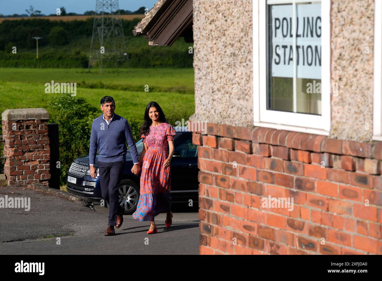 Prime Minister Rishi Sunak and his wife Akshata Murty arrive to cast their vote in the 2024 ...