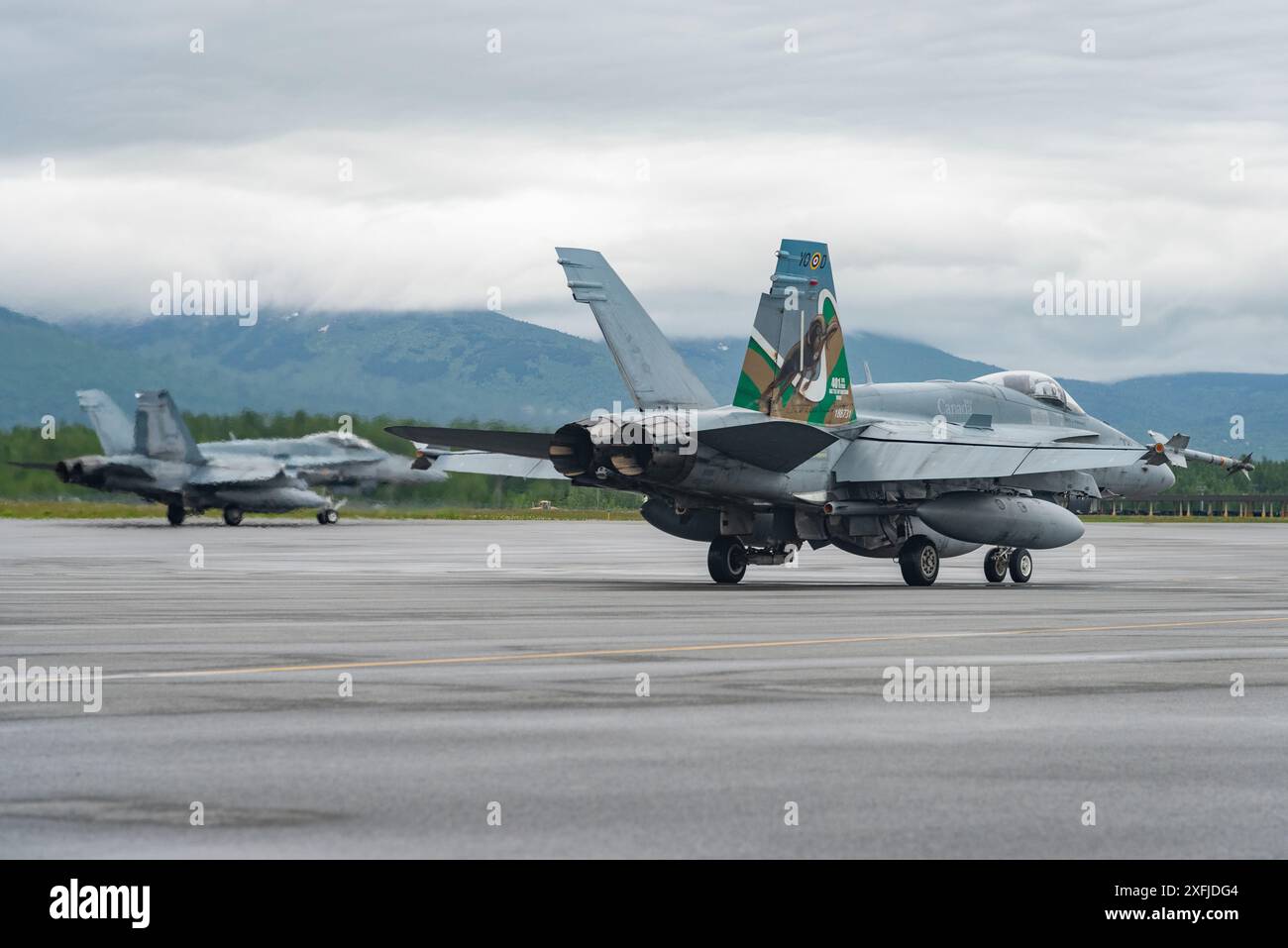 North American Aerospace Defense Command CF-18 Hornets taxi to ...