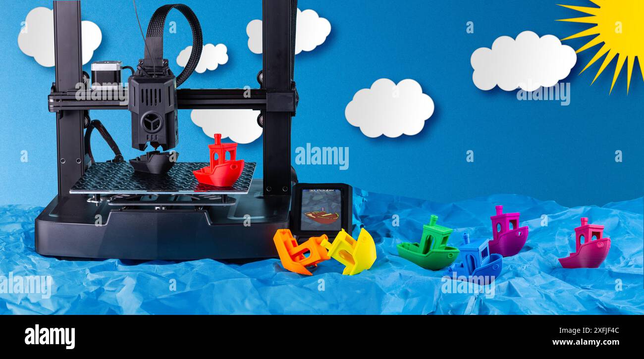 Colorful model printed boats droping into paper ocean after production ...