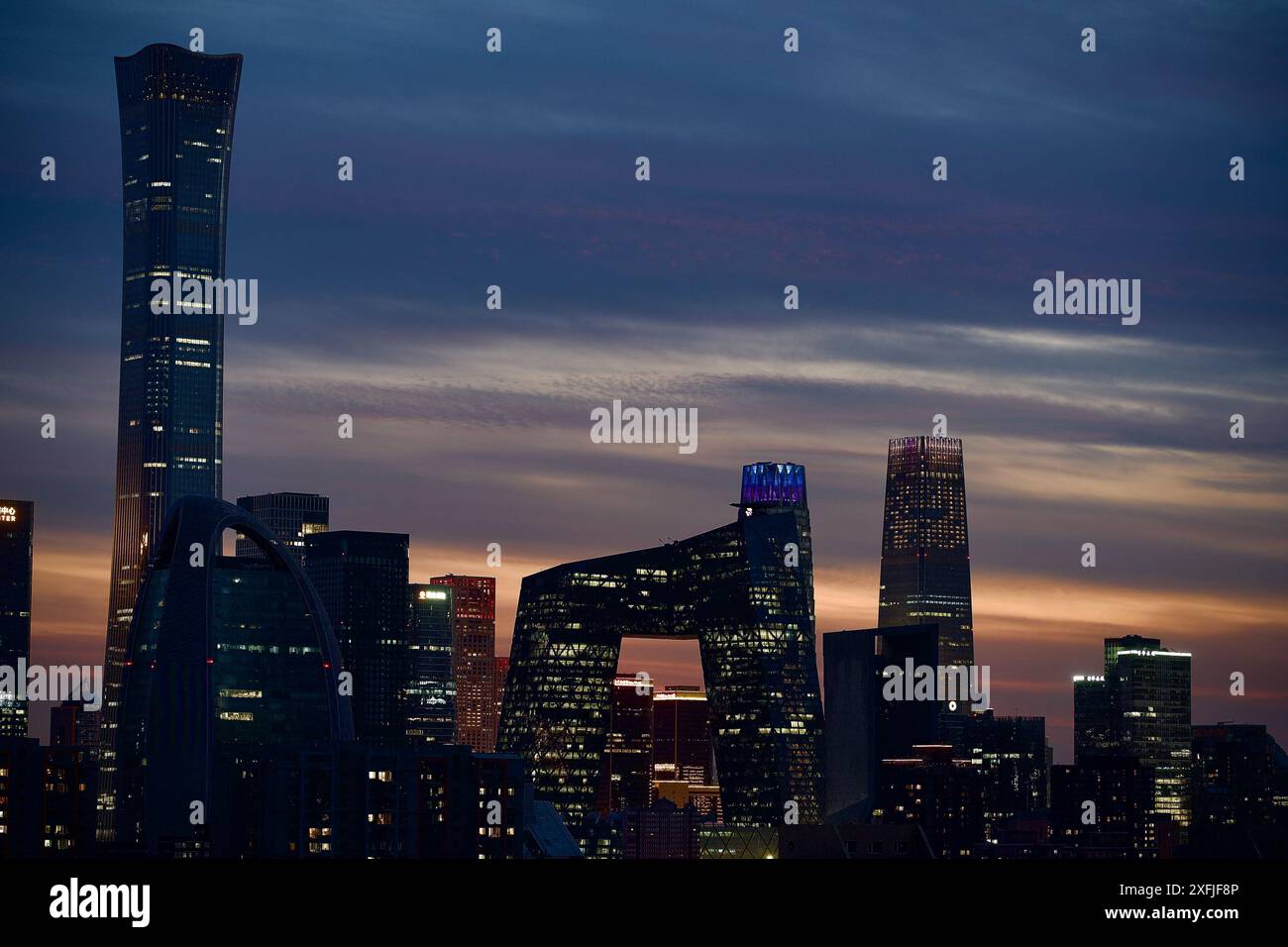 A stunning cityscape of Beijing's skyline at dusk with prominent modern ...