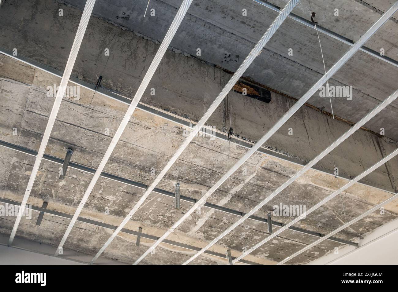 Install metal frame for plaster board ceiling at house under ...