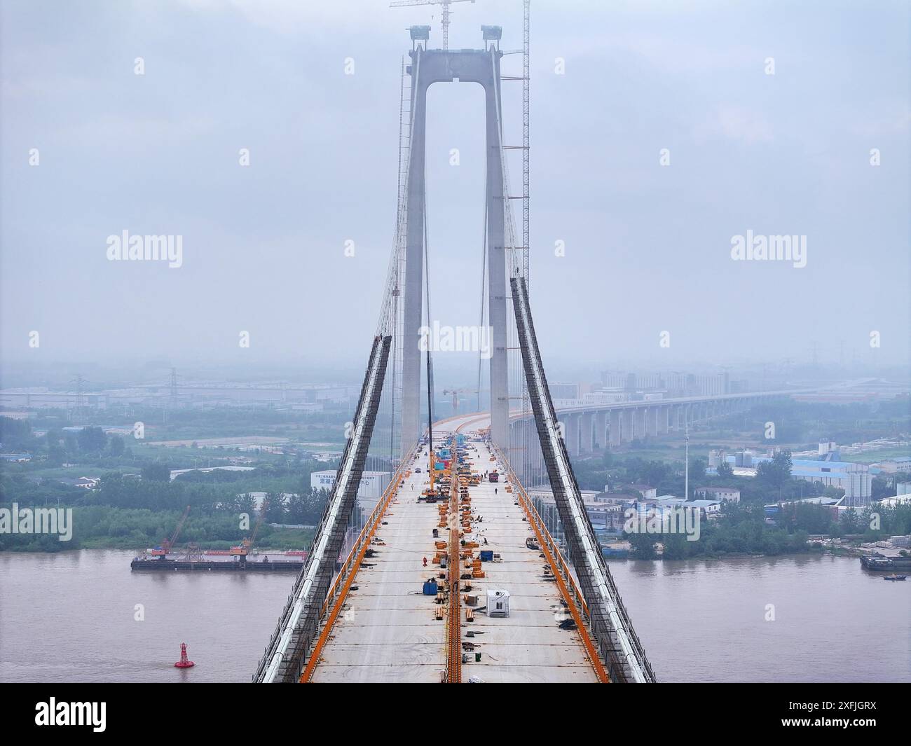 Aerial photo shows the Longtan Yangtze River Bridge under construction ...