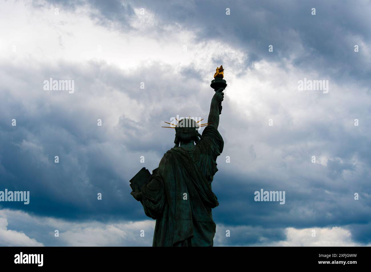 Statue of Liberty seen from behind against the light (silhouette ...