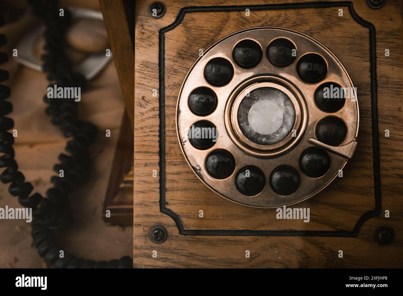 Wooden case of an old vintage rotary telephone. Retro telephones with ...