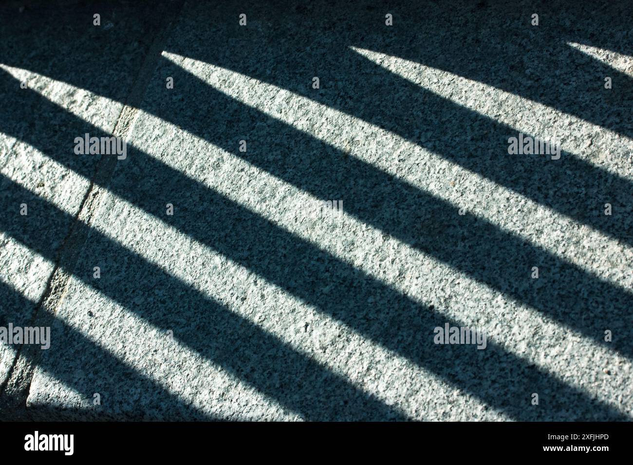 Abstract minimal background of contrasting shadow lines on a cement ...