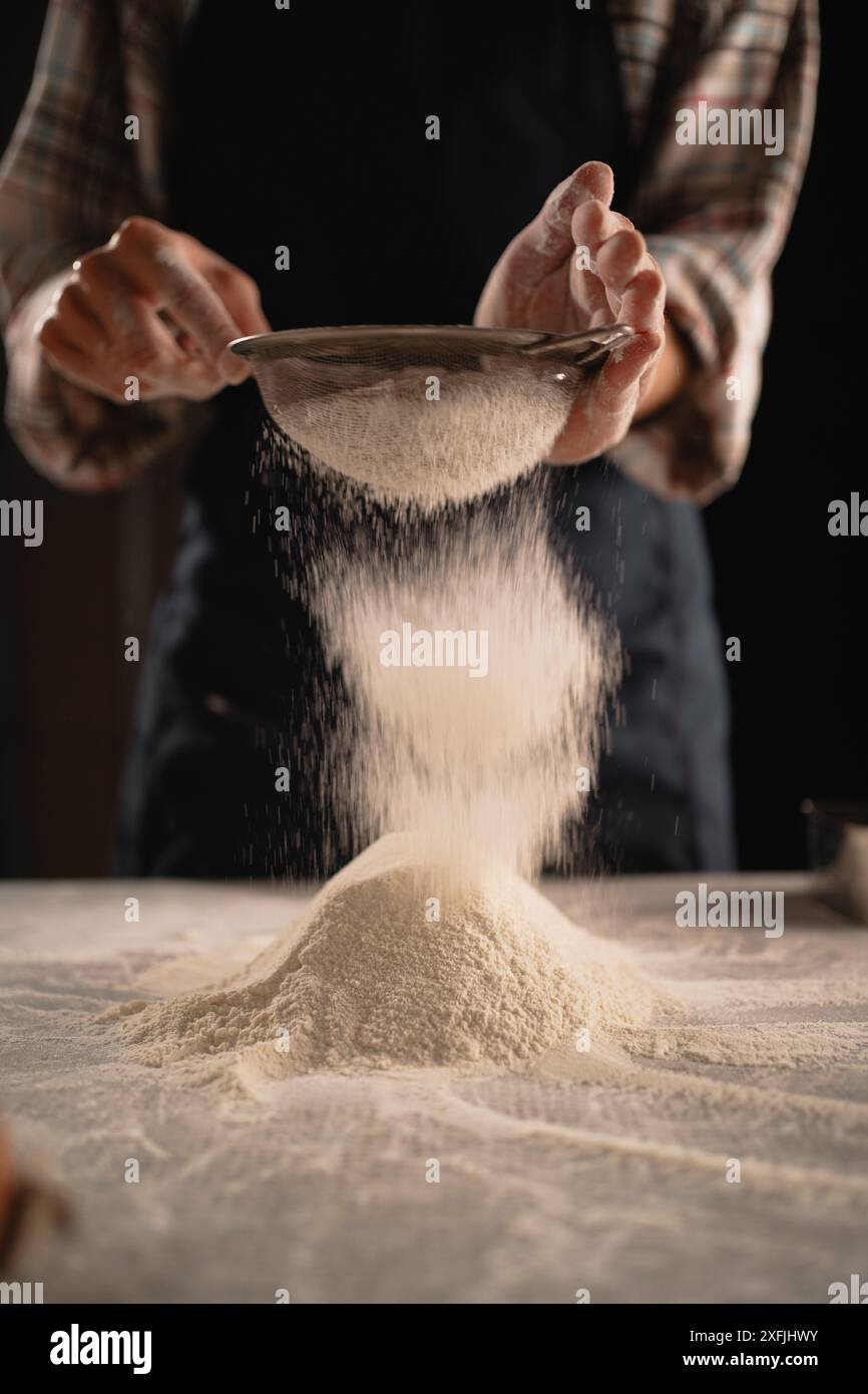 Sifting flour by hand is essential for achieving a fluffy texture in ...