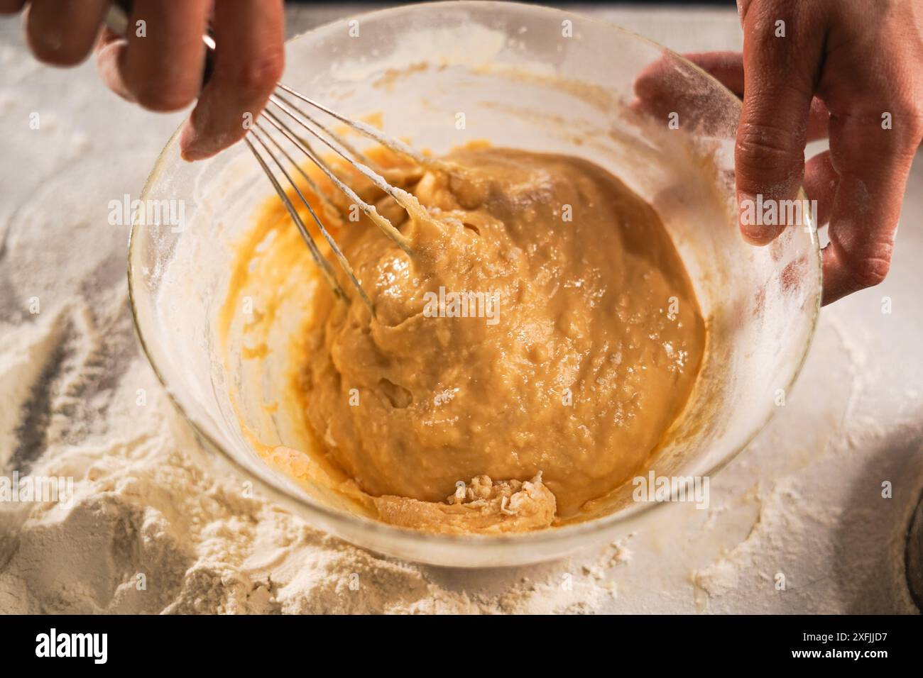 Pastry chef making dough with a whisk. cooking waffle on rustic wooden ...