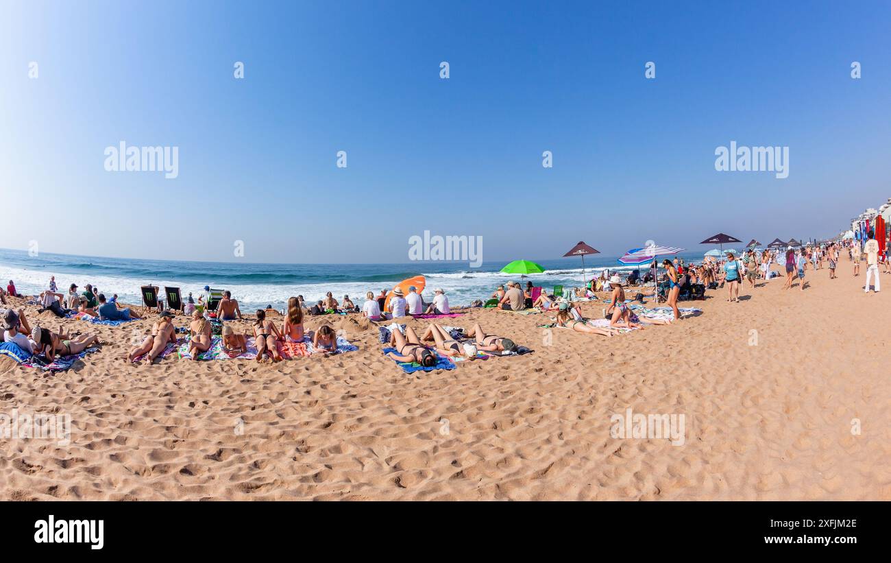 Beach blue sea ocean waves holiday crowd people sunbathing on sand a ...