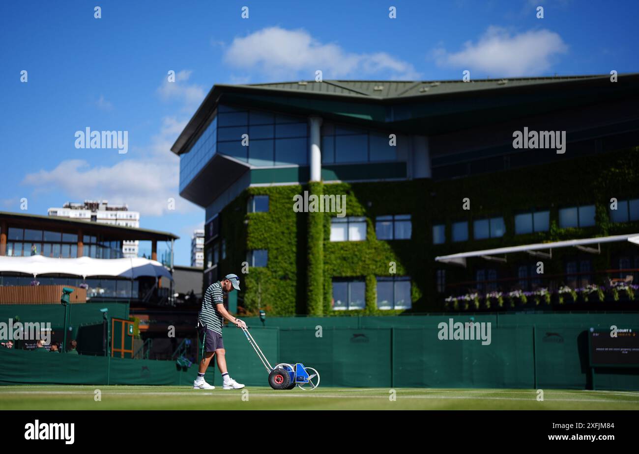 Ground staff prepare the outside courts on day four of the 2024 ...