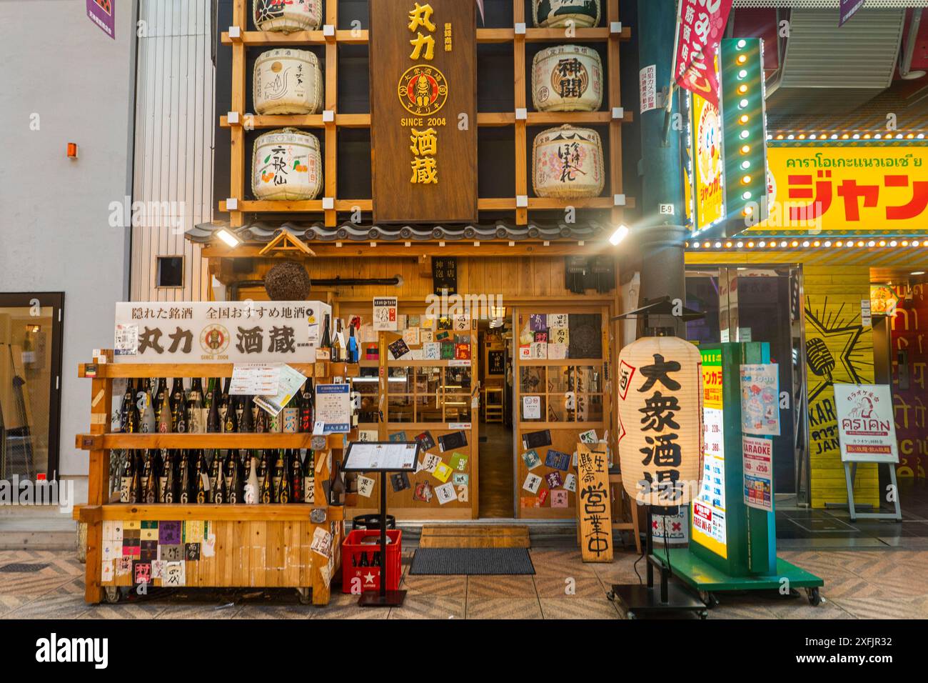 Osaka, Japan Tenma district, Sake shop bottles barrles Stock Photo - Alamy