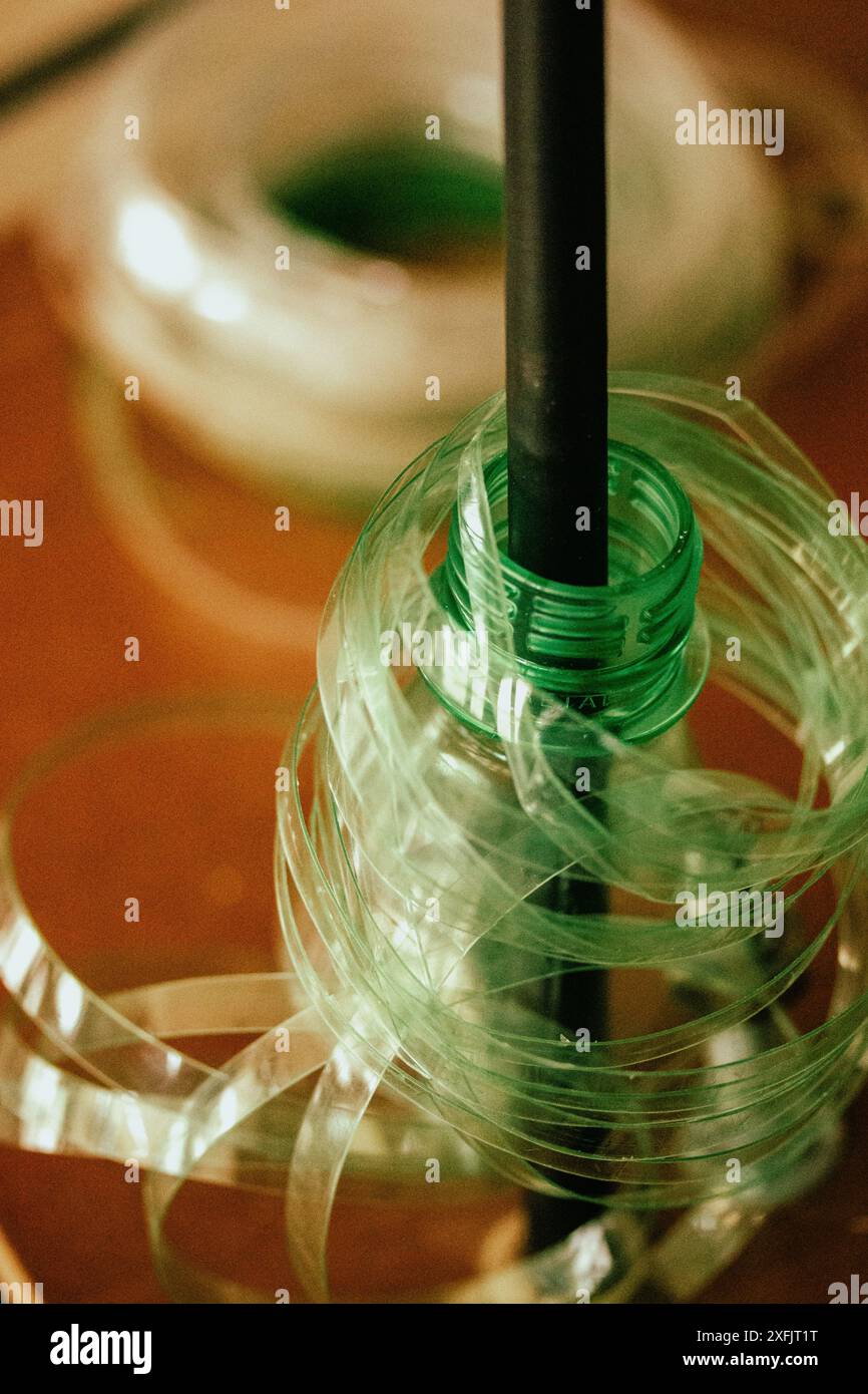 Recycling green plastic bottle to be reused for manufacturing. New life ...