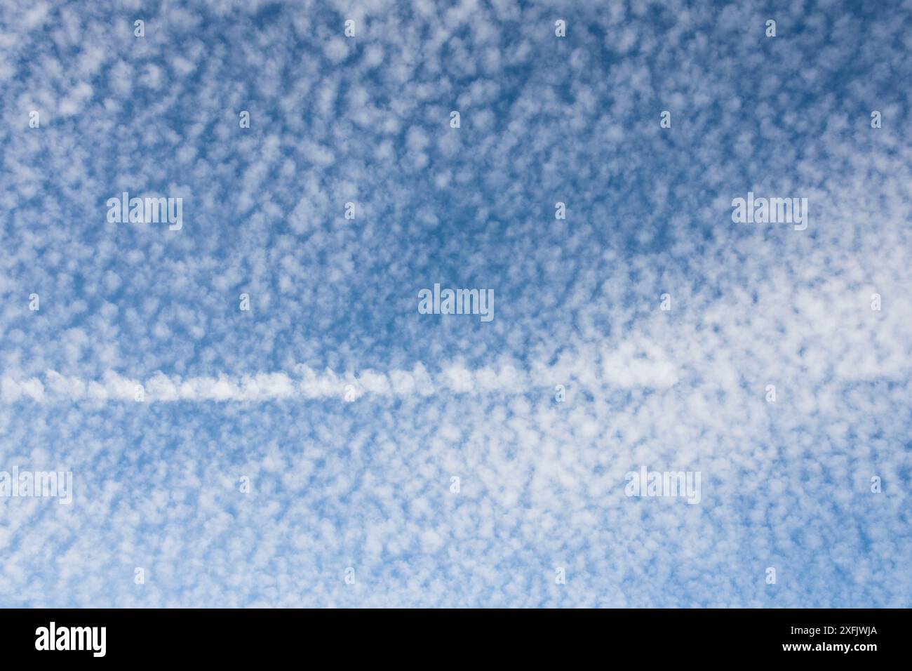 alto cumulus clouds, altocumulus, weather phenomena, plane leaves a trail through clouds, blue ...