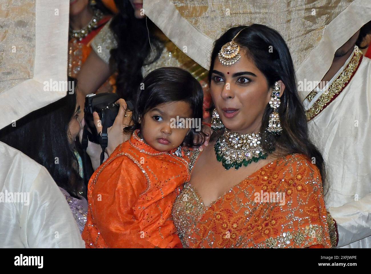 Isha Ambani is seen holding her son at the 'Mameru' (traditional ...
