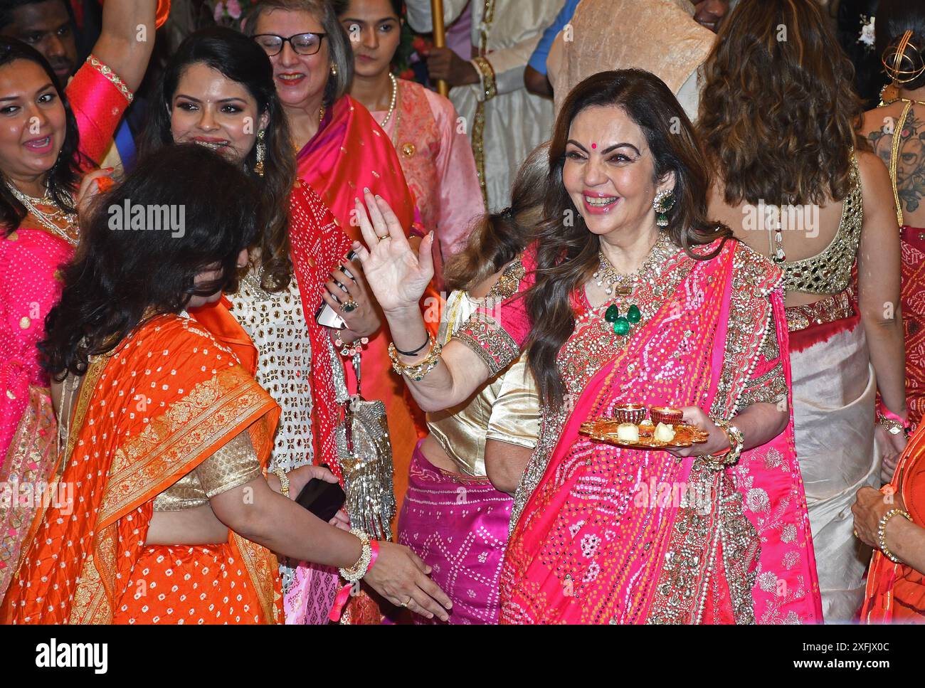 Indian philanthropist and business woman Nita Ambani (R) welcomes ...