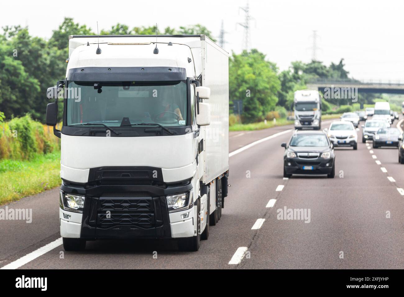 Long trailer freight semi truck on a highway with motion blur effect ...
