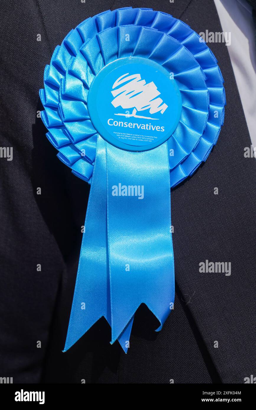 Wimbledon, London, UK 4 July 2024. A teller wearing a conservative ...