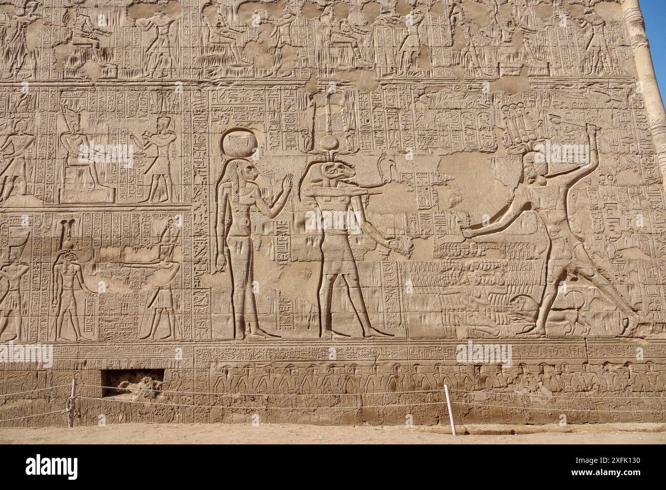 Exterior walls with smiting scene at the Temple Of Khnum at Esna, Egypt ...