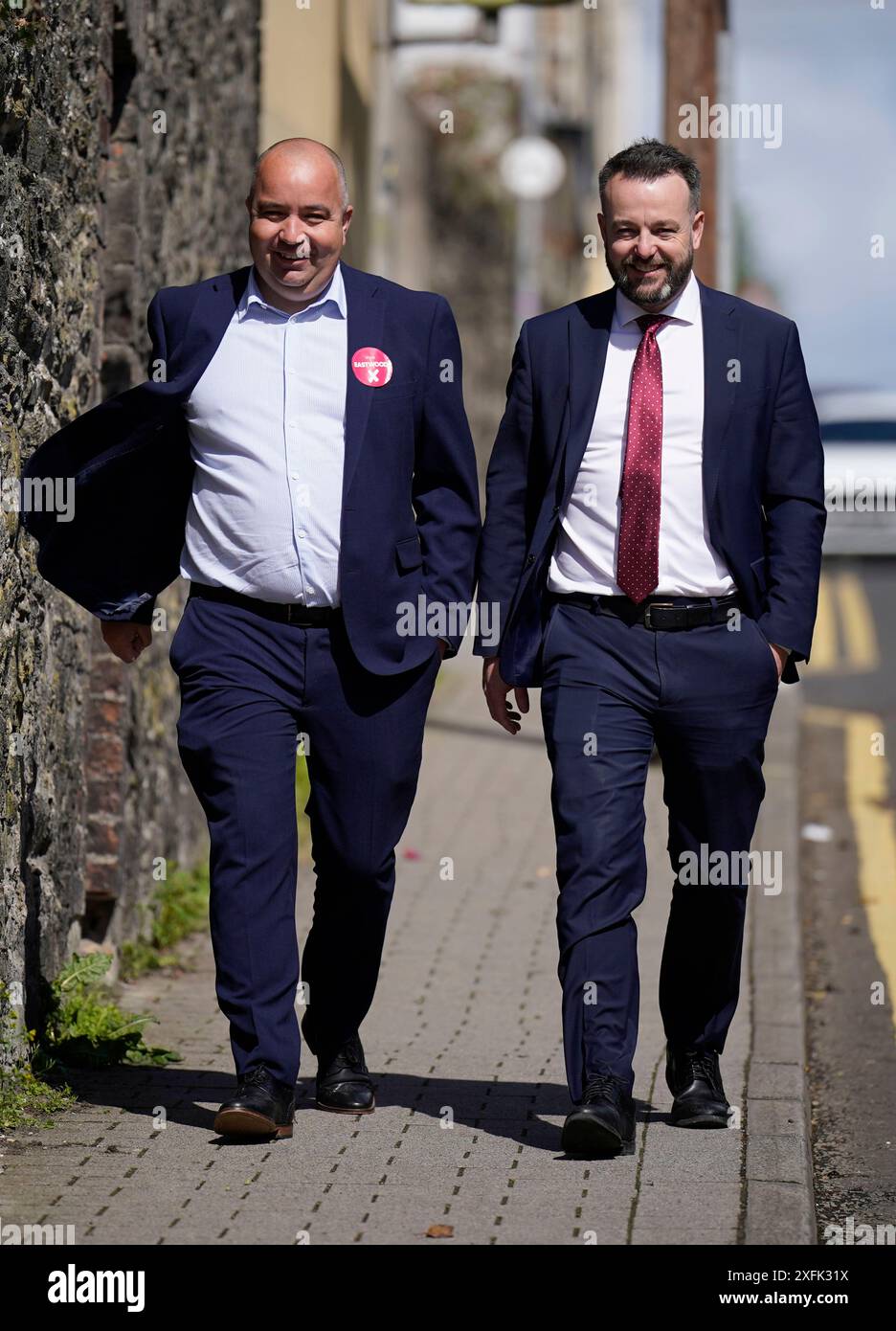 SDLP leader Colum Eastwood (right) arrives with Councilor Brian Tierney ...