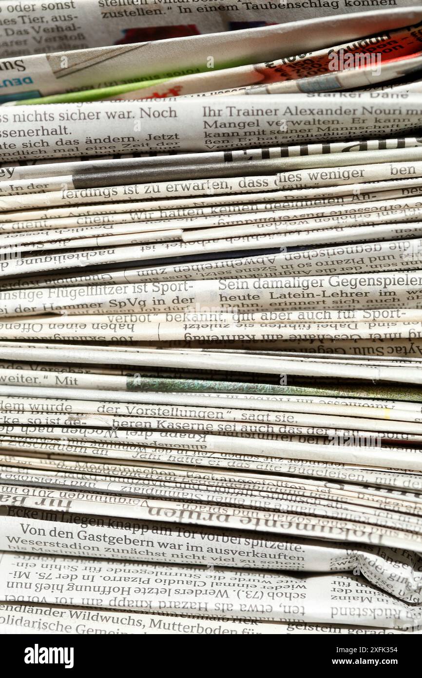 Stacked daily newspapers, Germany, Europe Stock Photo - Alamy