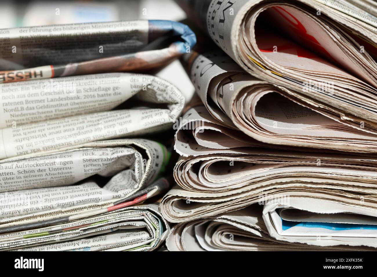Stacked daily newspapers, Germany, Europe Stock Photo - Alamy