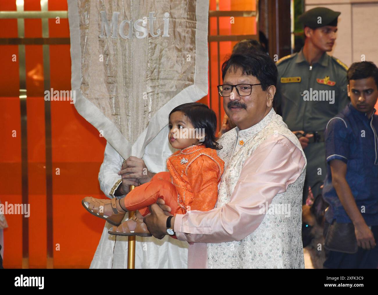 Indian businessman Ajay Piramal holds his grand child at the 'Mameru ...
