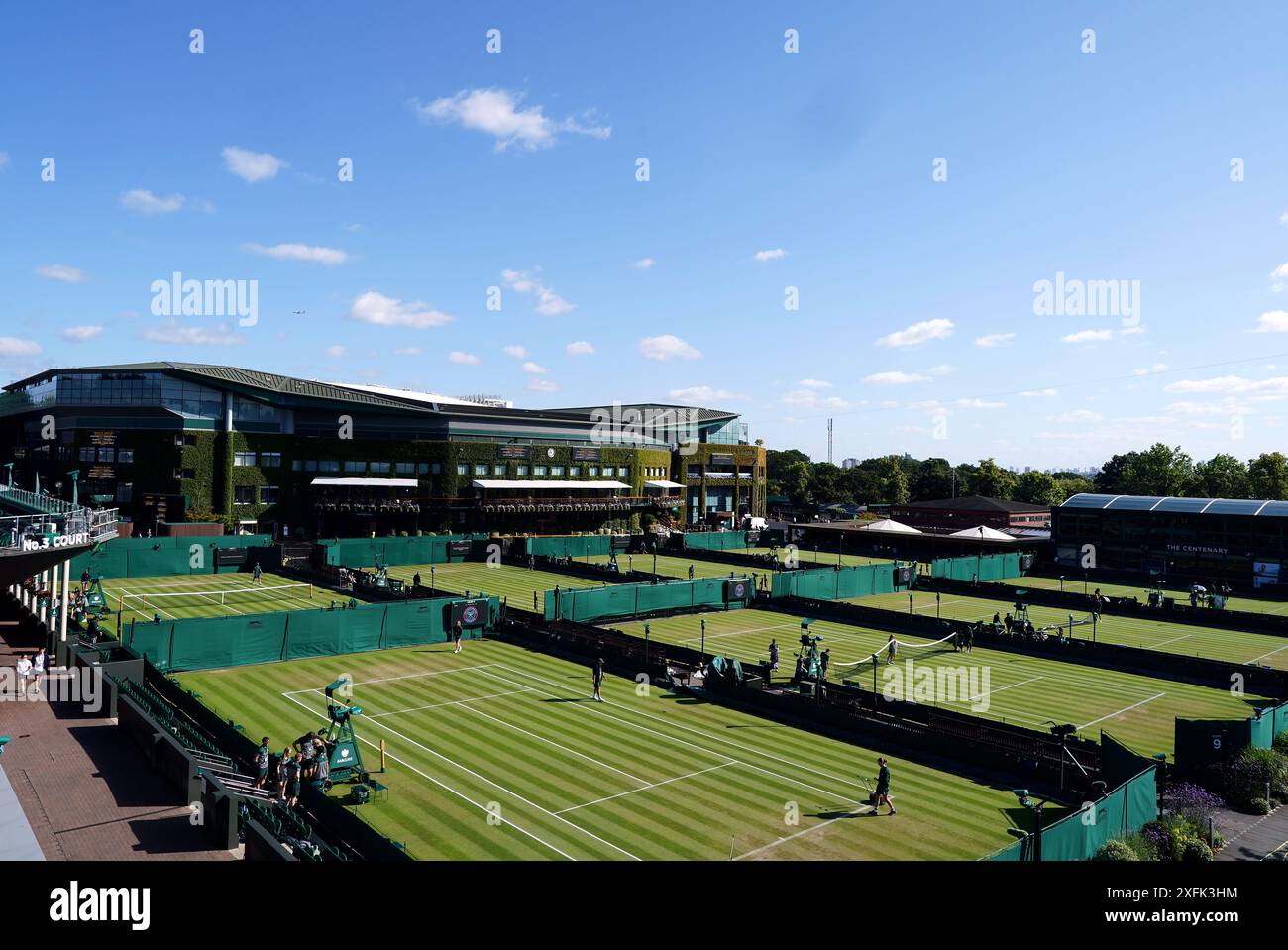 Ground staff prepare the courts on day four of the 2024 Wimbledon ...