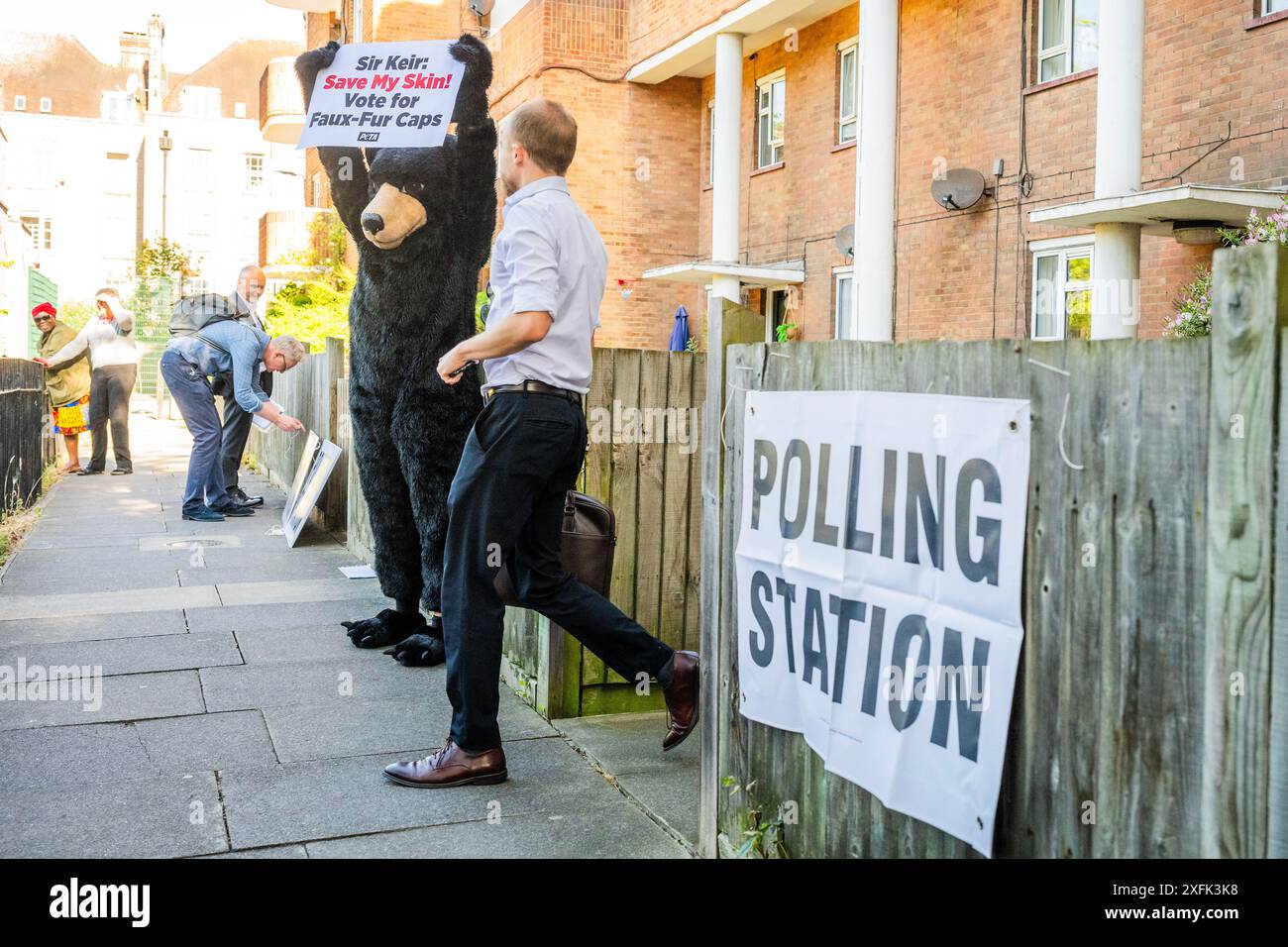London, UK. 4 Jul 2024. A PETA protester dressed as a bear holds a ...