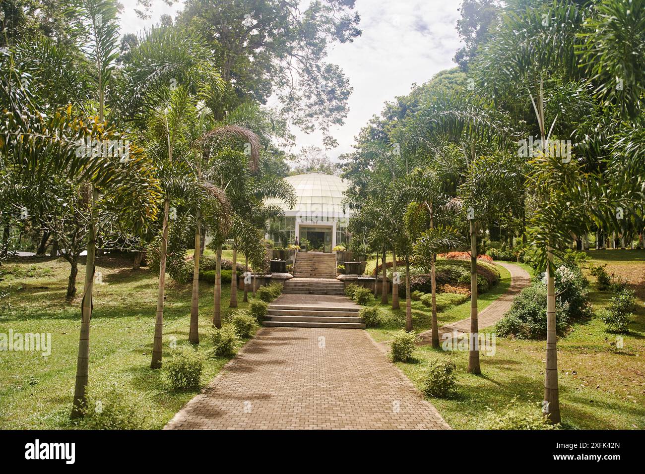 View of the orangery with a round roof in the Royal Botanic Garden of ...