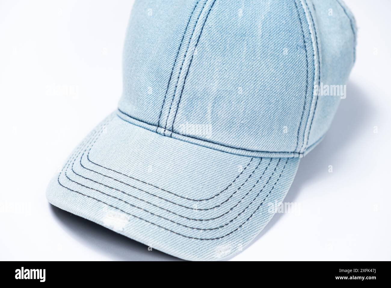 Blue denim cap close-up on white background Stock Photo - Alamy
