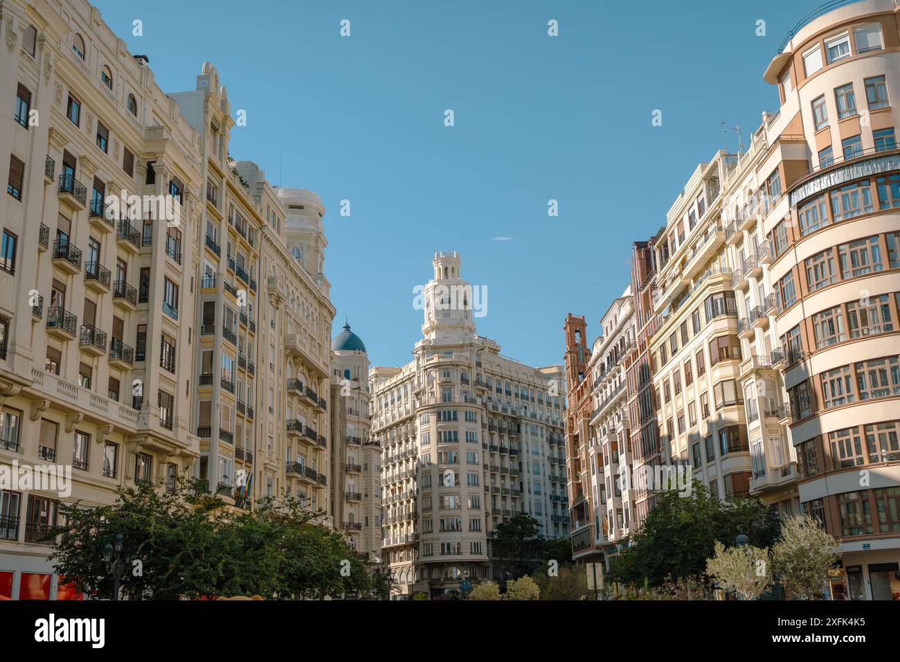 Majestic historic buildings lining a street in Valencia. The detailed ...