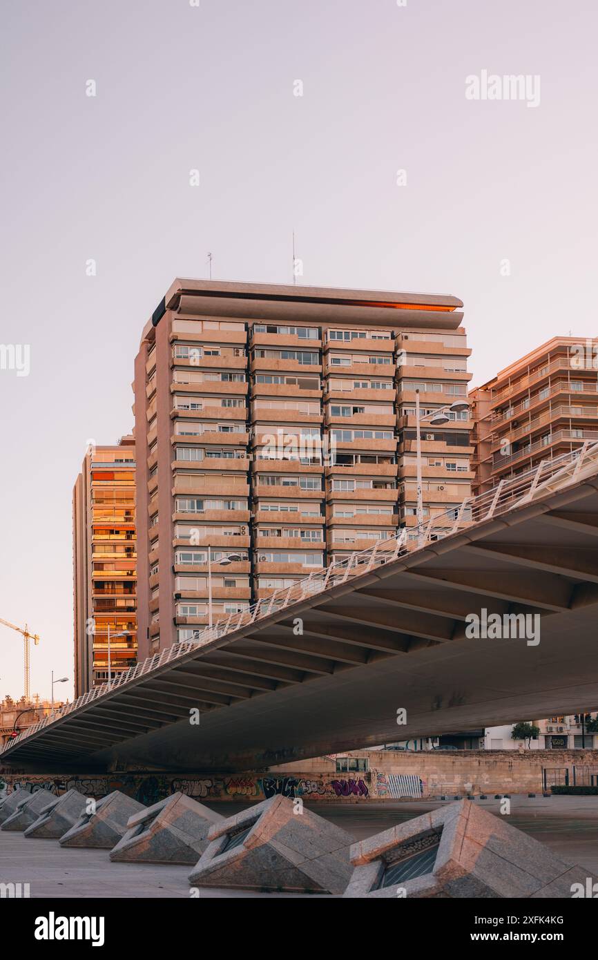Urban scene featuring a distinctive bridge and tall residential ...