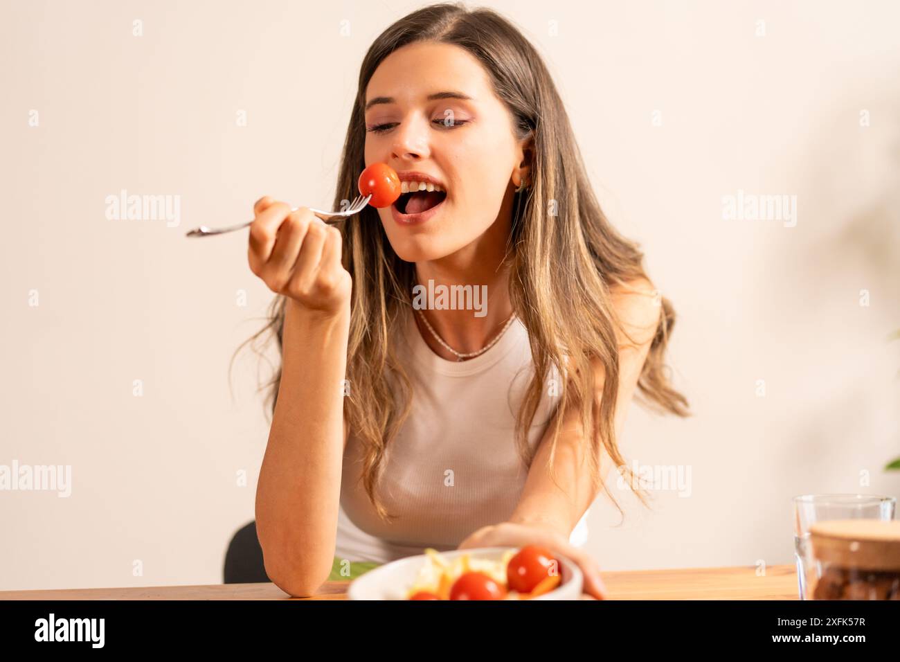Woman eating cherry tomatoes - healthy snack and lifestyle, enjoying ...