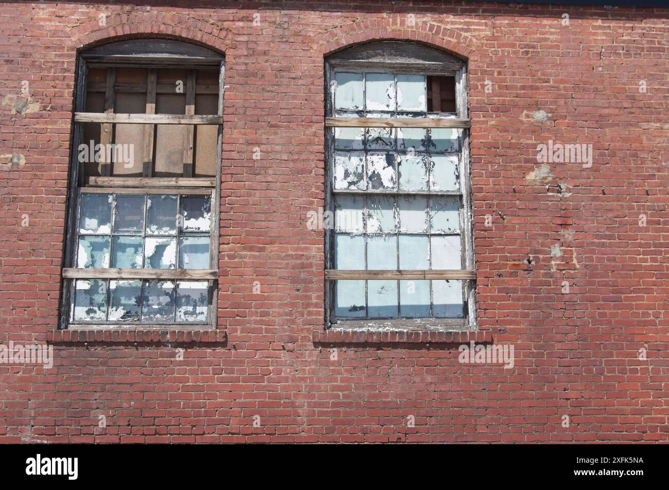Abandoned brick industrial building with broken and weather worn ...