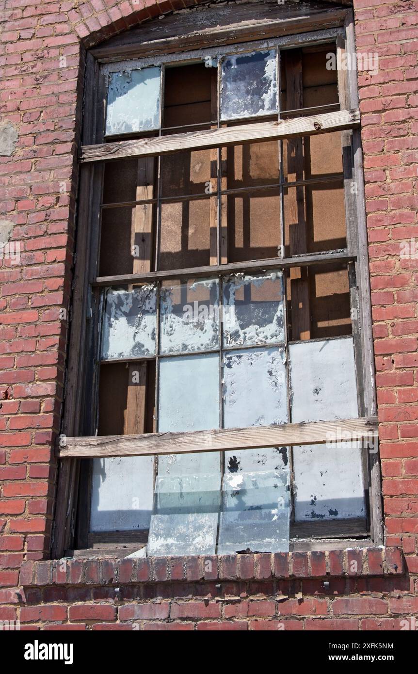 Abandoned brick industrial building with broken and weather worn ...