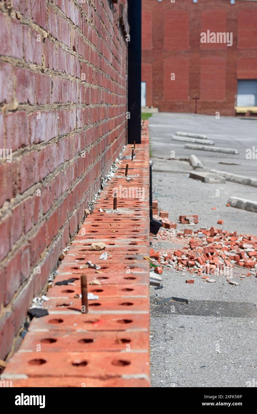 Brick ledge with debris and rusty bolts Stock Photo - Alamy