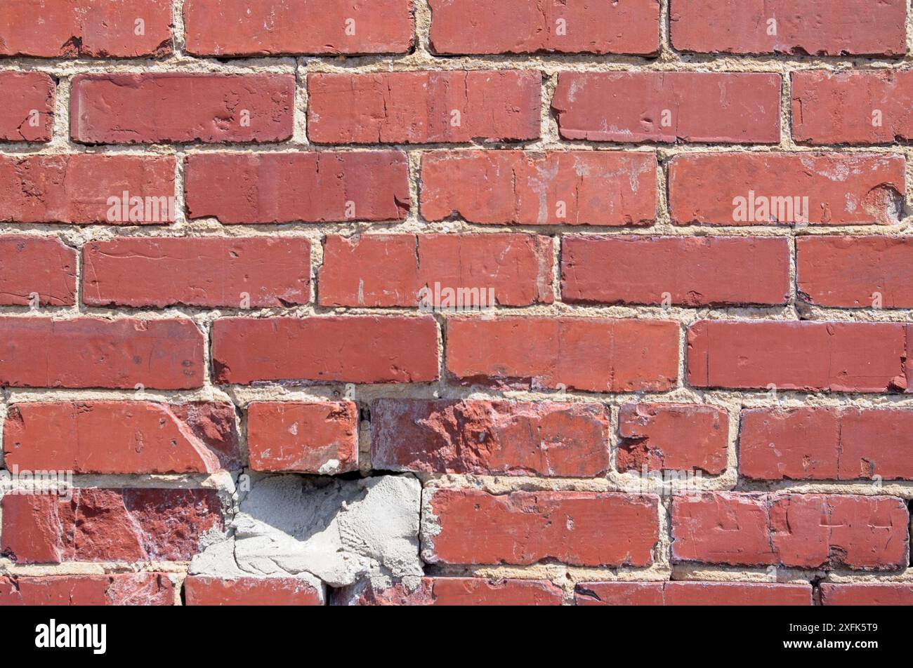 Brick wall with missing brick filled in with mortar Stock Photo - Alamy