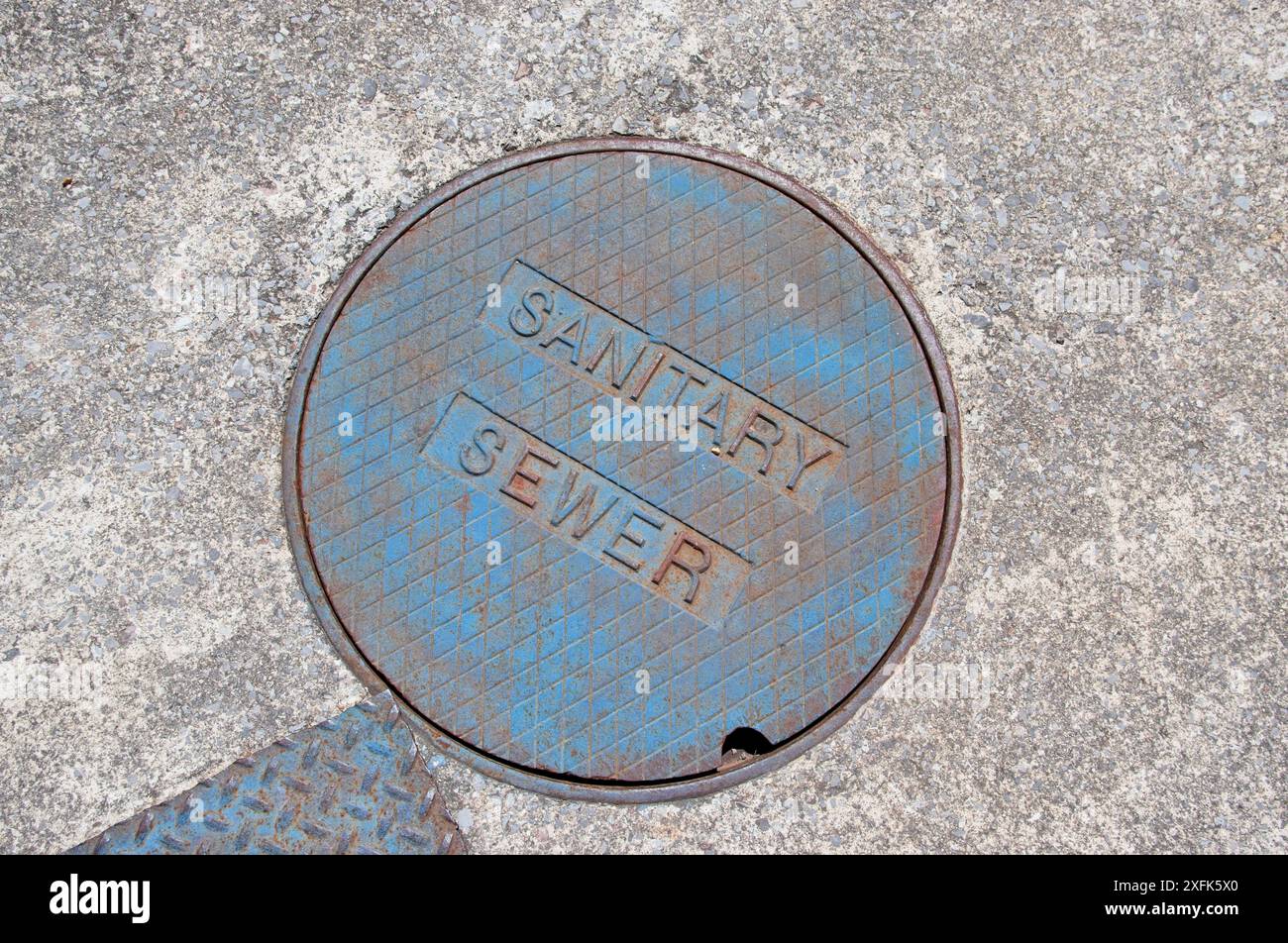 Manhole cover for a sanitary sewer Stock Photo - Alamy