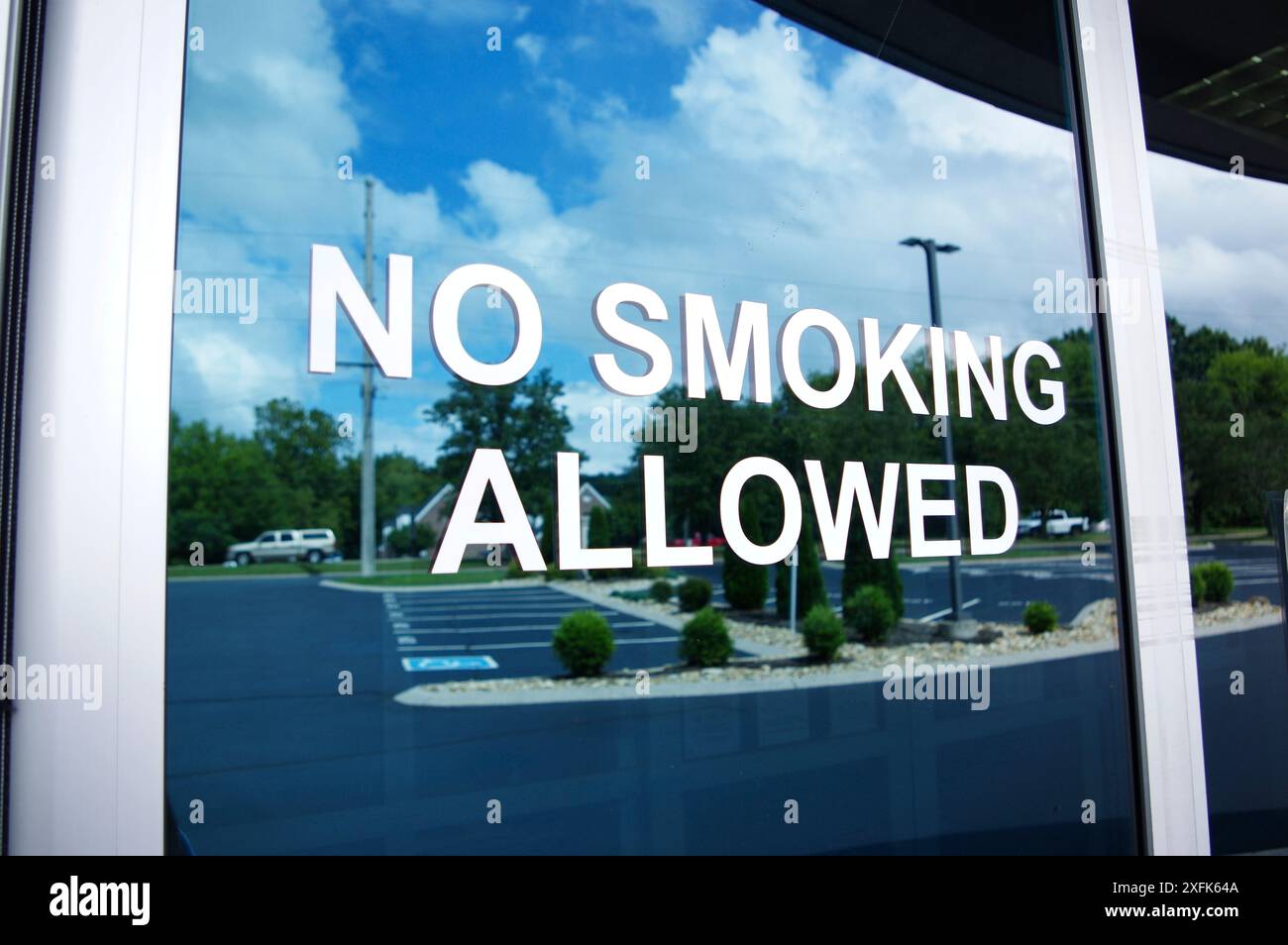 Glass Door with No Smoking Allowed lettering Stock Photo - Alamy
