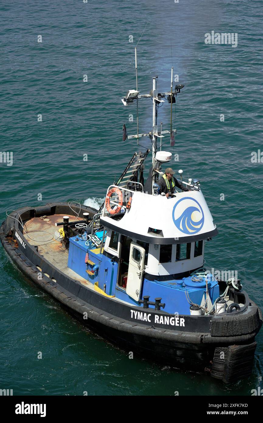 Vancouver, Canada - 23rd June 2024:The captain of Tymac Ranger tug boat sterring from the top of ...