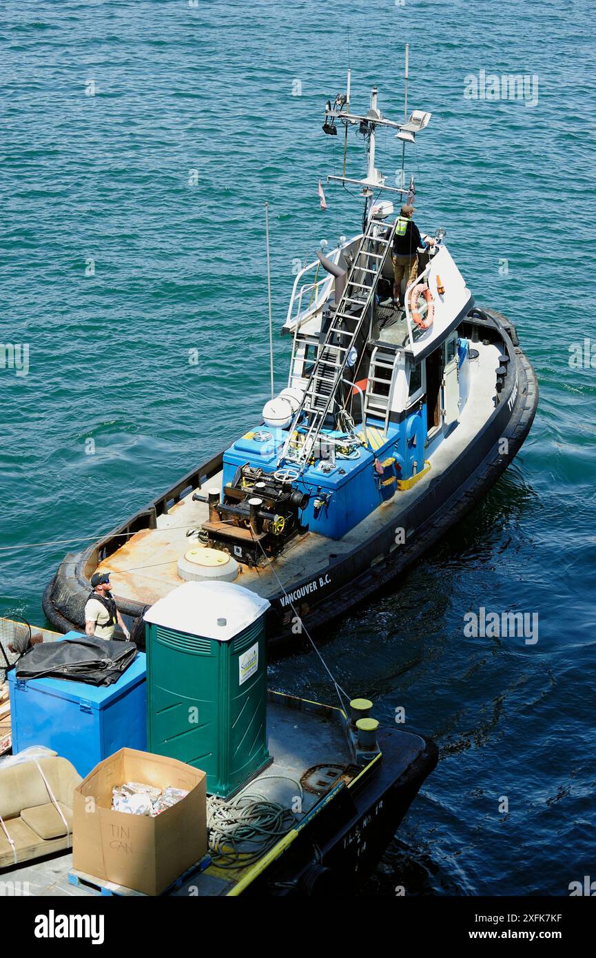 Vancouver, Canada - 23rd June 2024:The captain of Tymac Ranger tug boat sterring from the top of ...