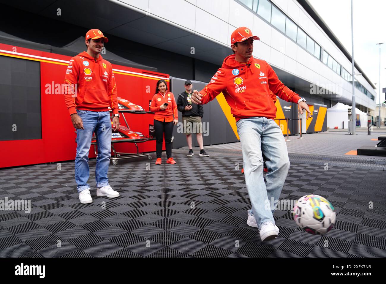 Ferrari's Charles Leclerc (right) and team-mate Carlos Sainz playing ...