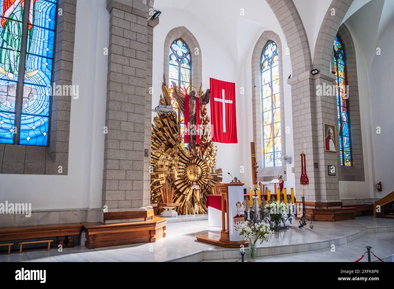 Altar with Jesus Christ and a cross in interior of Christian Catholic ...