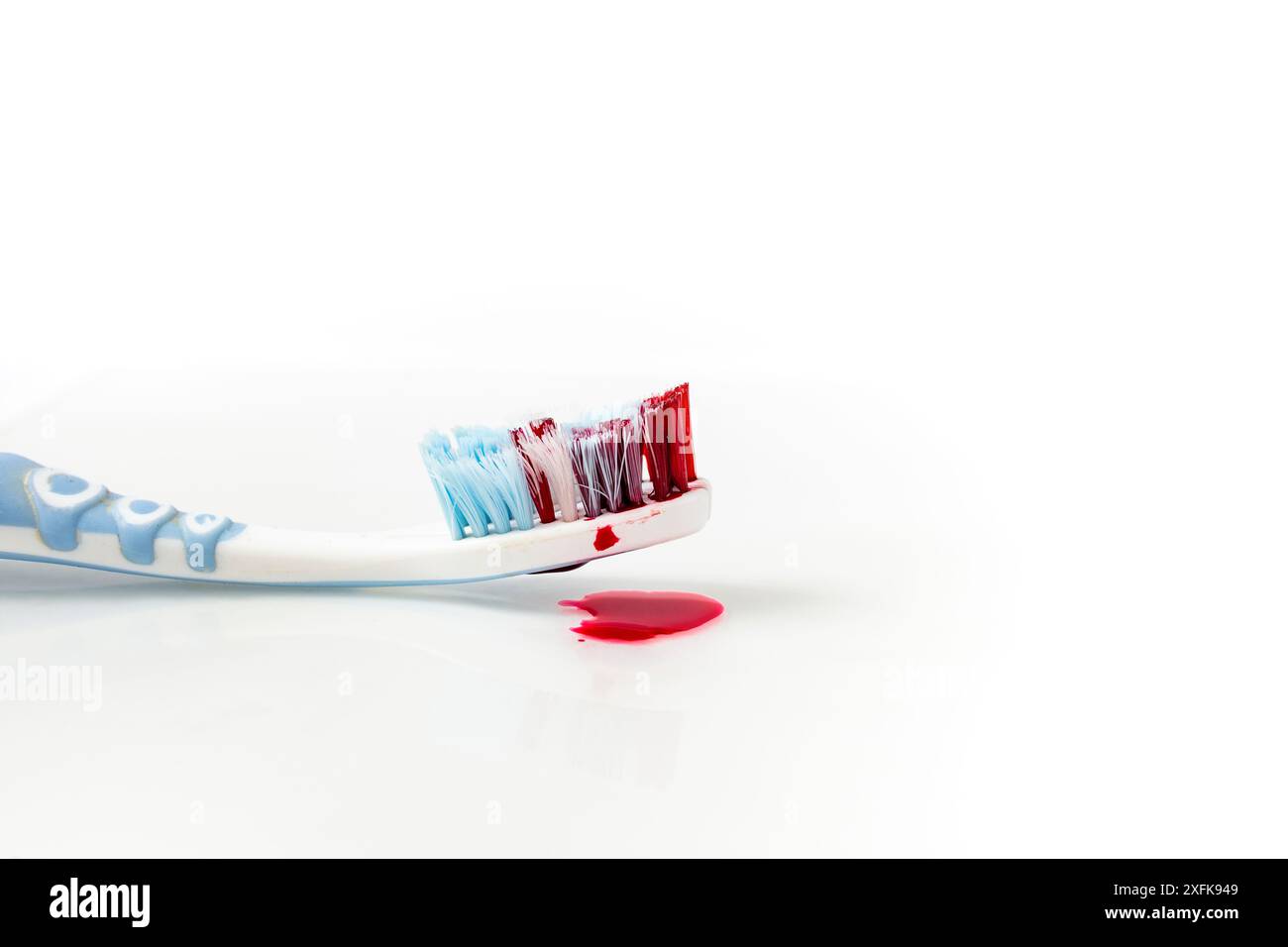 Tooth brush with blood drops on white background, soft focus Stock ...